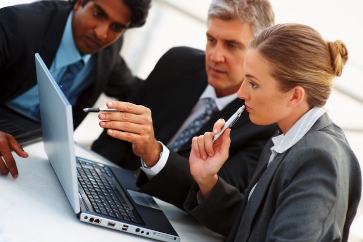 people looking at a computer - Evalex